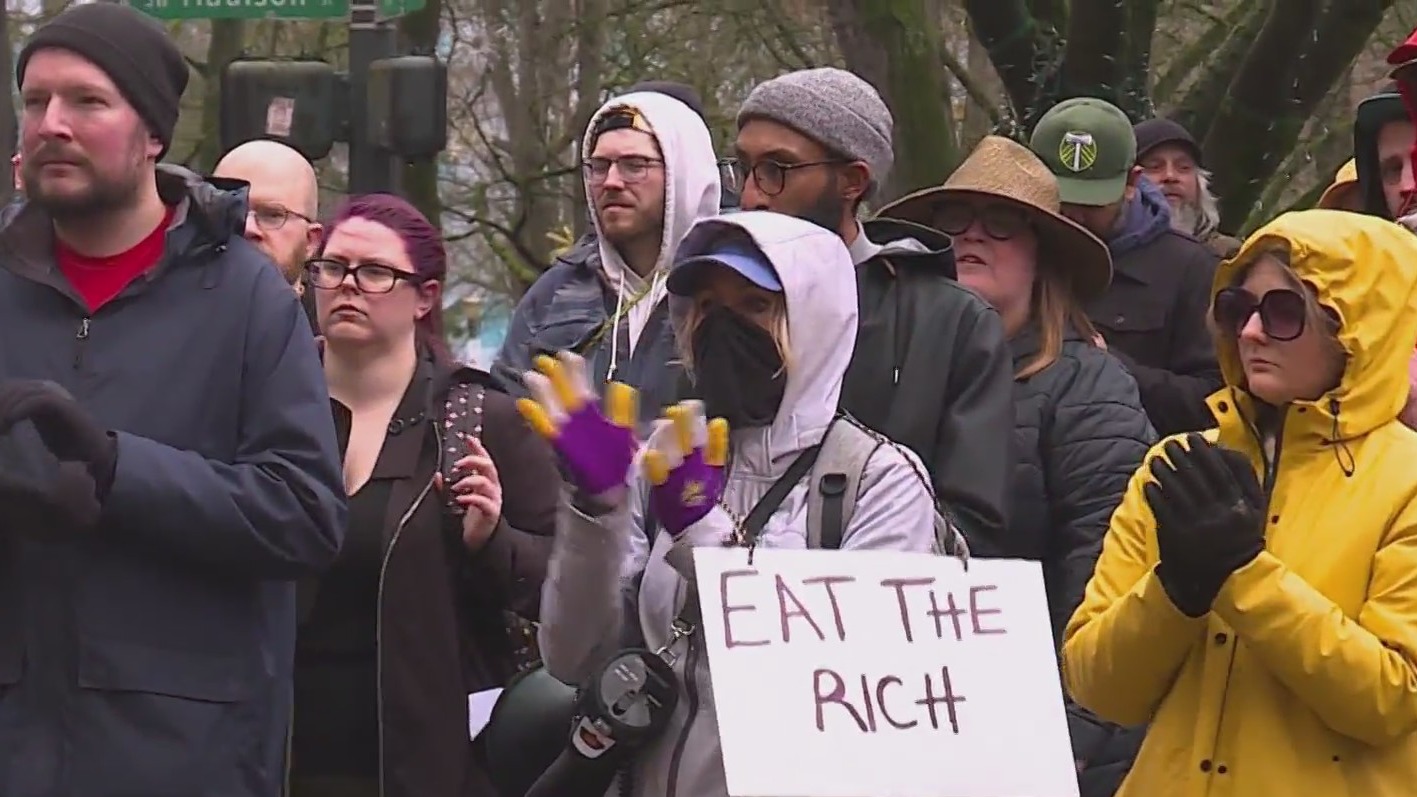 Dozens protest federal, city budget cuts at downtown Portland rally