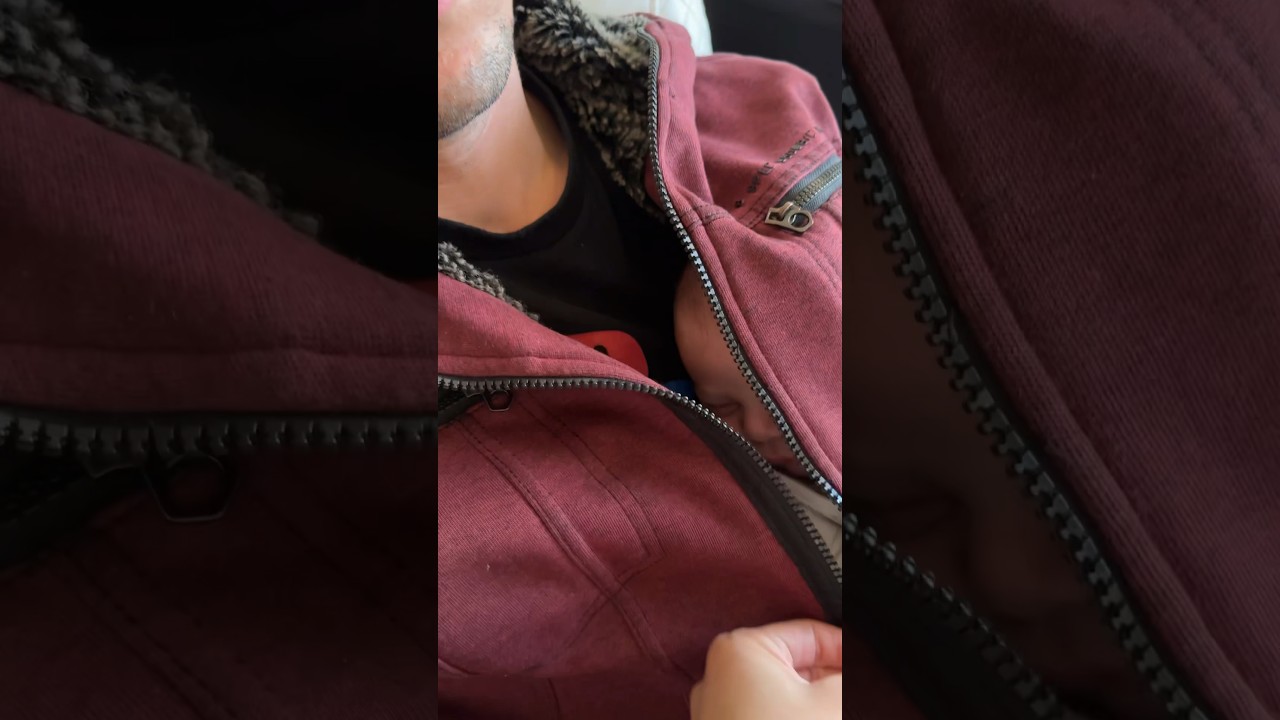 Baby hilariously hides inside dad’s oversized cozy jacket