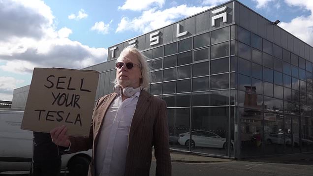 Protesters gathered outside Tesla dealership call for boycott