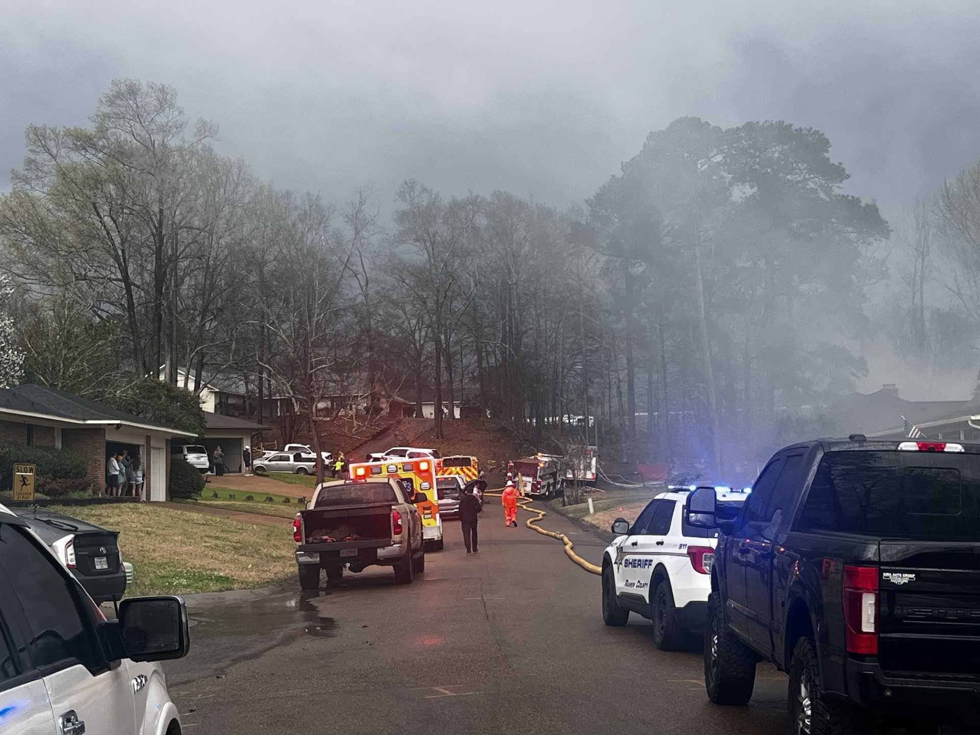 Winds fanning house fire in Flowood