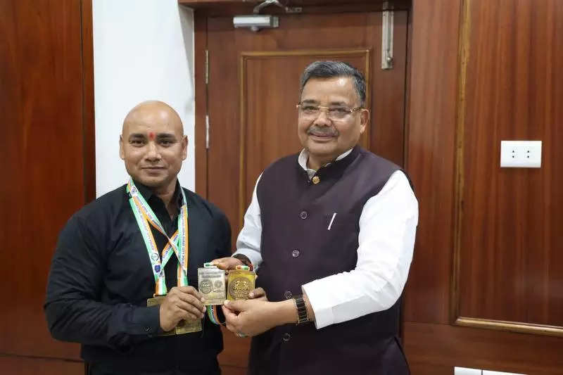 UP tourism staffer fetedfor winning 4 gold medals