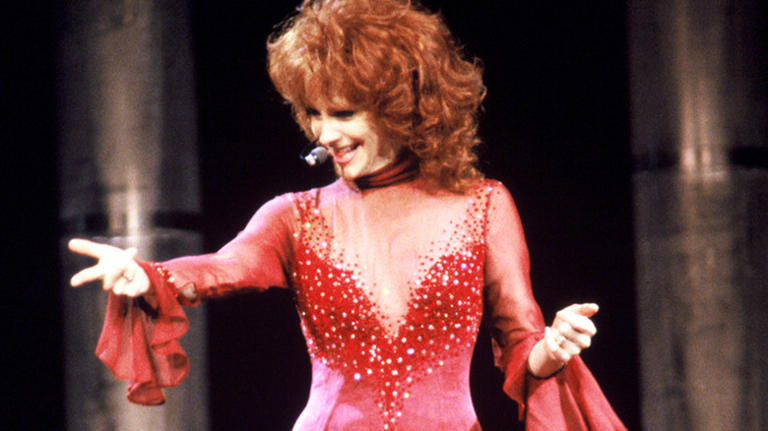 The Story Behind Reba McEntire's Most Scandalous Outfit Ever Worn