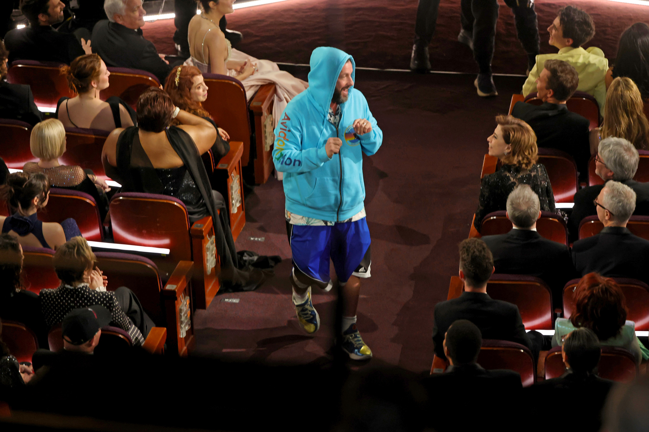 Adam Sandler Leaves the Oscars in a Hoodie — But Not Before Yelling in ...