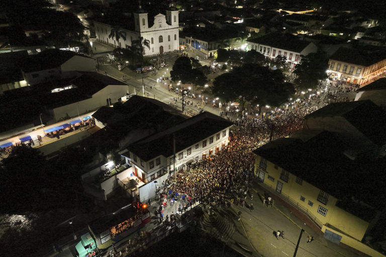Families and revelers party side-by-side in a traditional Carnival in ...