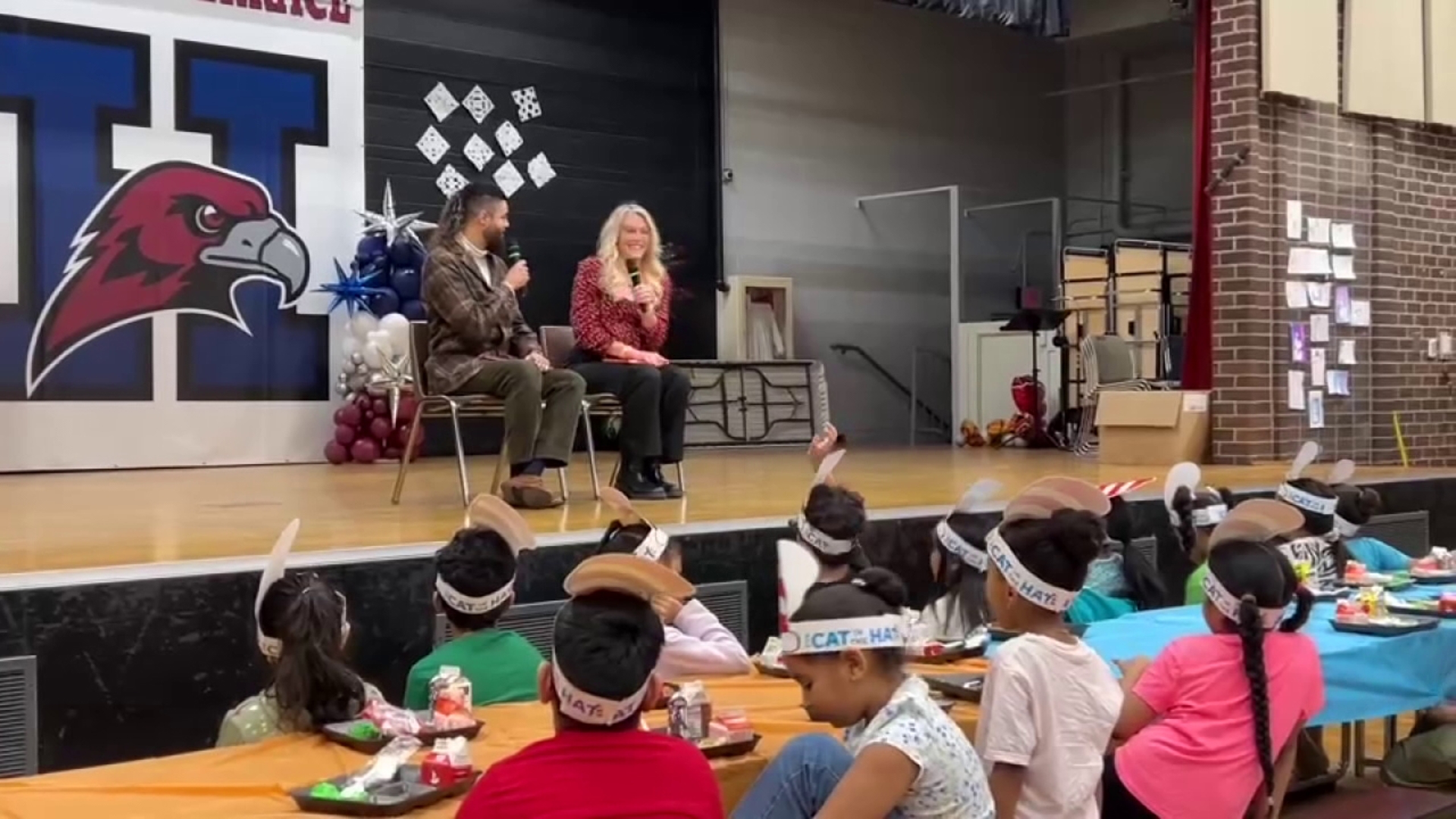 Newswatch 16's Chelsea Strub and Jeremy Lewan read to students in Hazleton