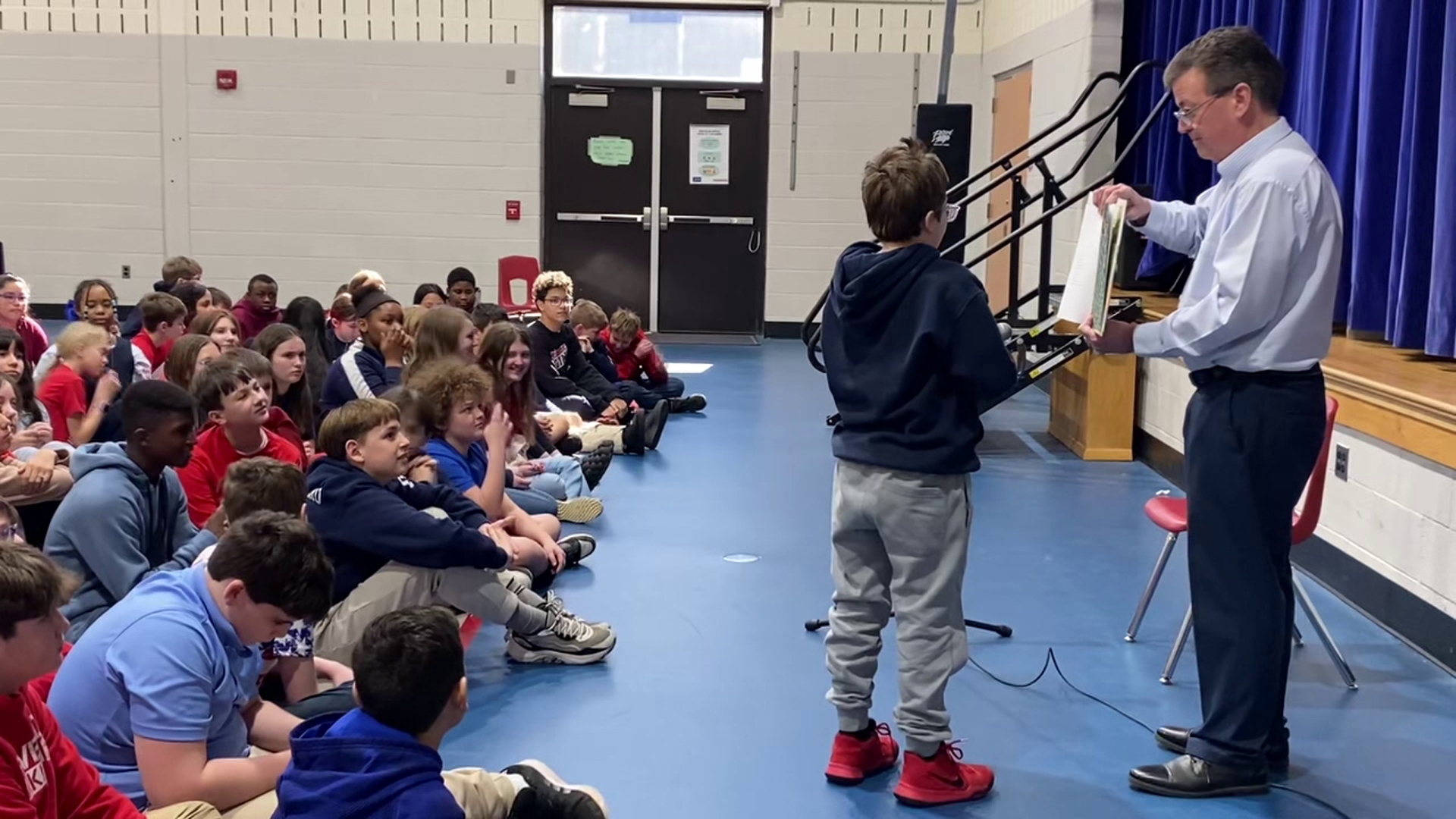 Chief Meteorologist Kurt Aaron reads to students in Lackawanna County