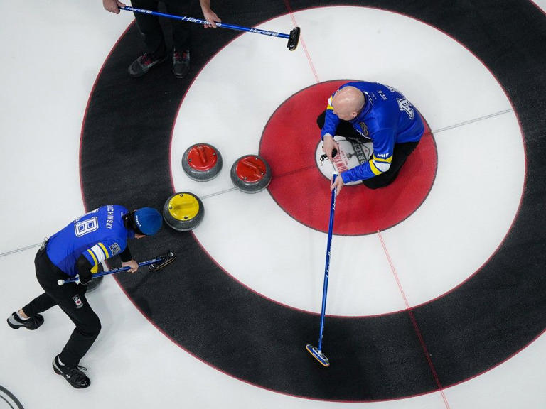 How has the ice crew taken care of frosty curling conditions at the Brier?