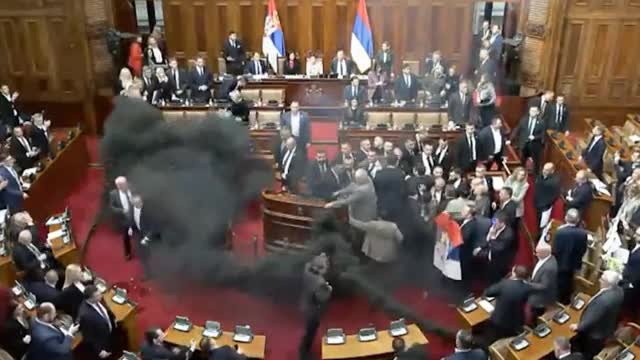Watch: Three injured as parliament chaos sees smoke bombs thrown at ...