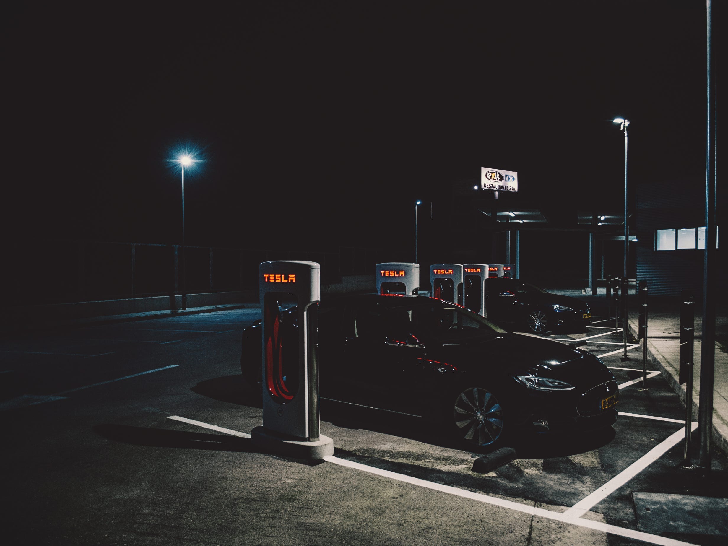 A Tesla Supercharging station was engulfed in flames. Police suspect arson.