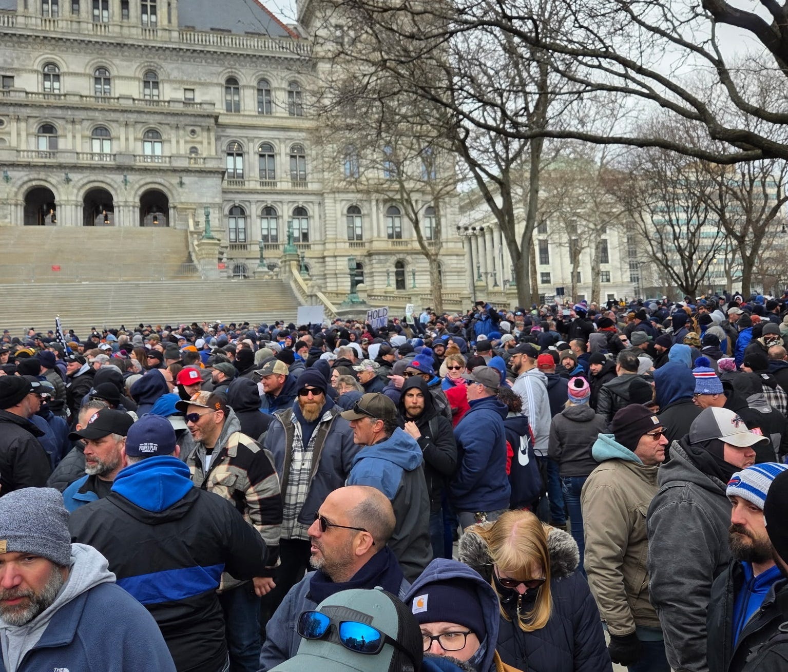 Thousands rally at state capitol as corrections officers strike enters ...