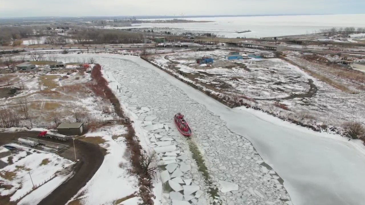 How does the historic Edward M. Cotter fireboat cut through the ice?
