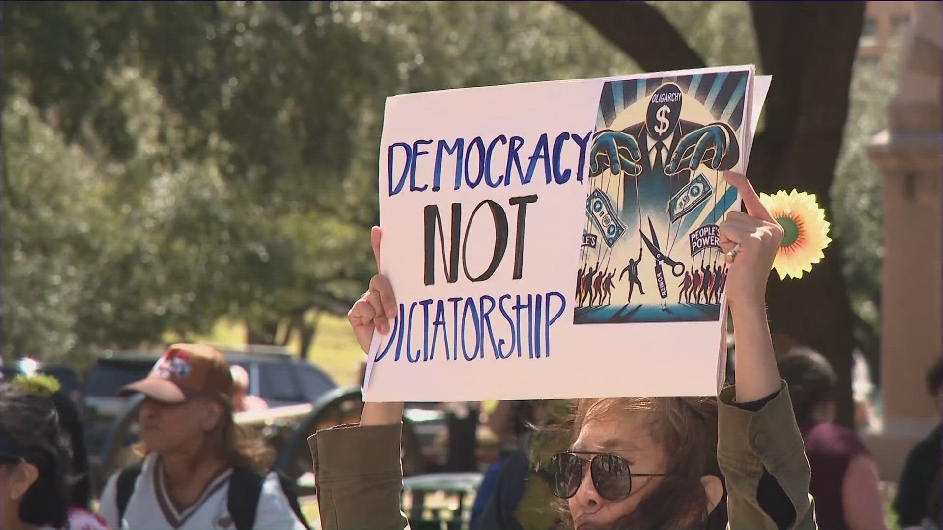 Demonstrators protest Trump administration outside Texas State Capitol