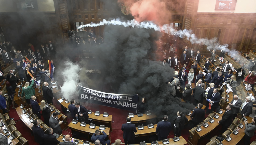 At least 3 Serbian lawmakers injured as smoke bombs and flares thrown ...