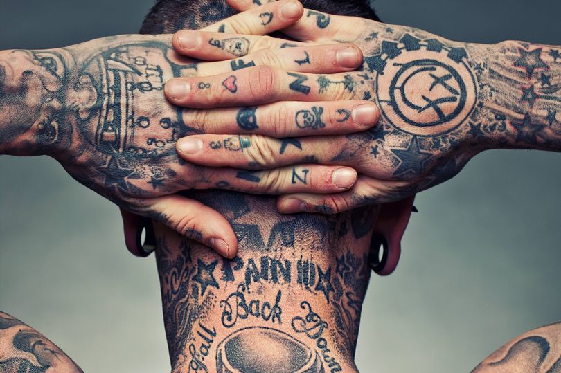 Scientists issue cancer warning as tattoo ink may not just stay where ...