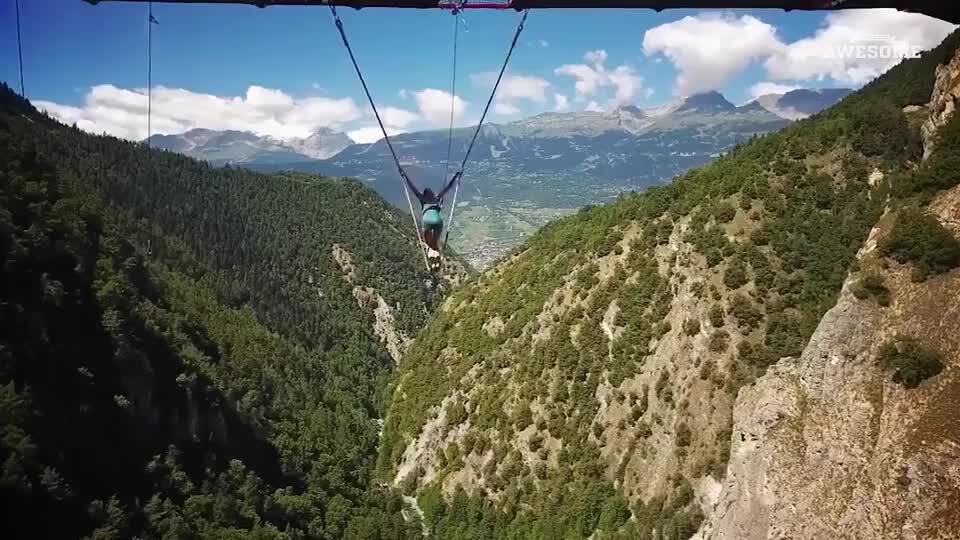 Acrobat Swings on a Bridge