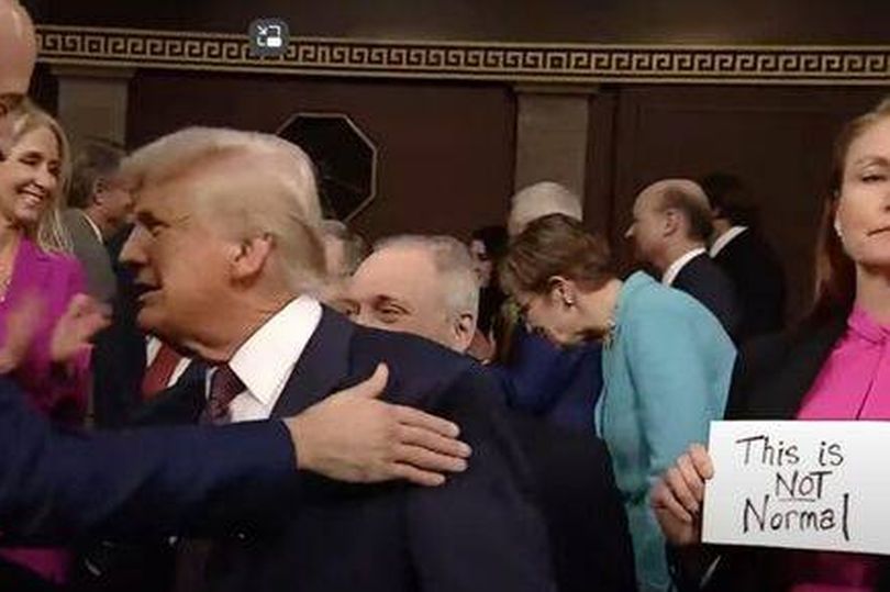 Four-word protest sign snatched from Democrat during Trump's Congress ...