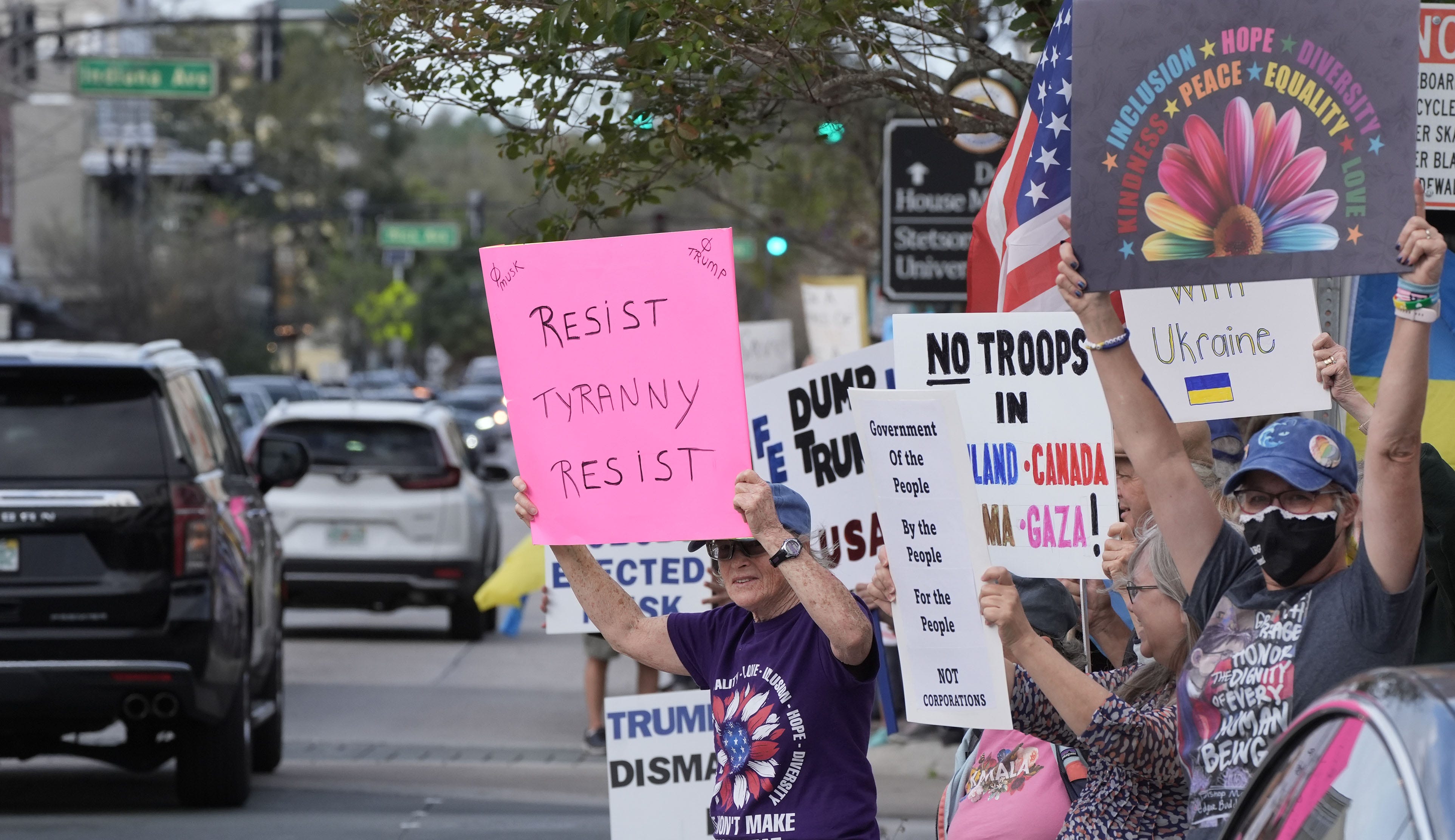 Hundreds protest President Trump, Elon Musk, support Ukraine in DeLand ...