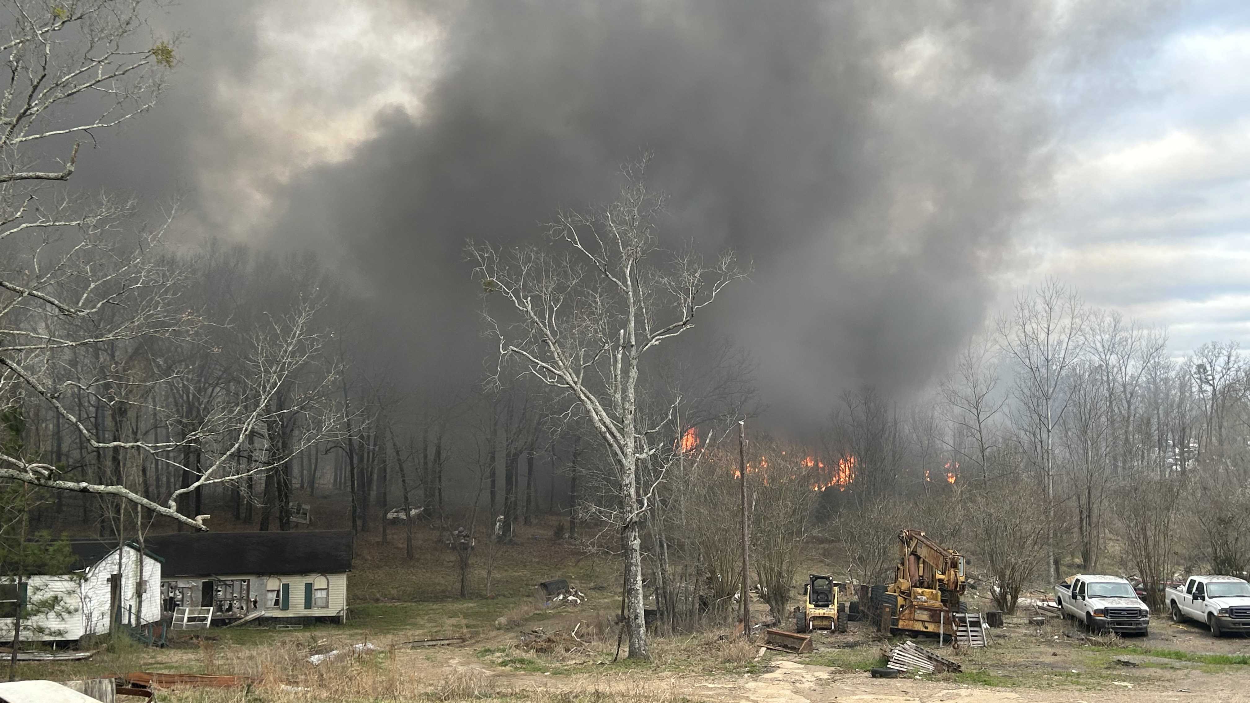 Junkyard fire spreads, creating black smoke across I-220