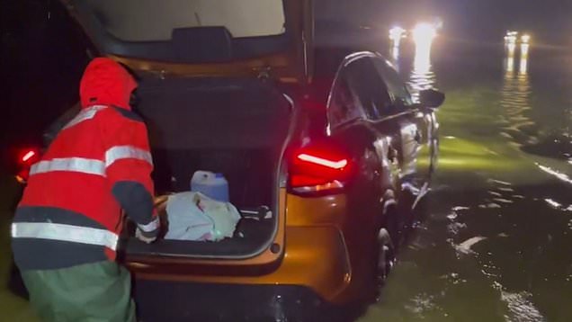 Spain flash floods leave cars stranded on roads