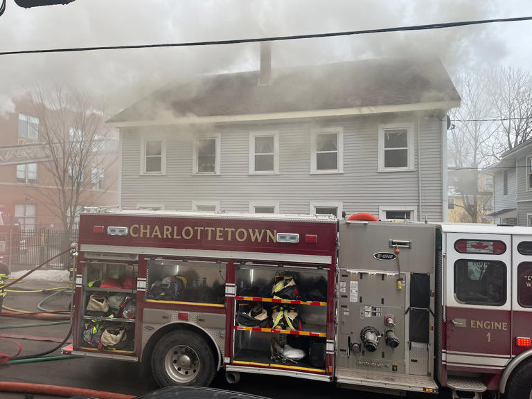 Flames shoot out of windows as apartment building burns in downtown ...