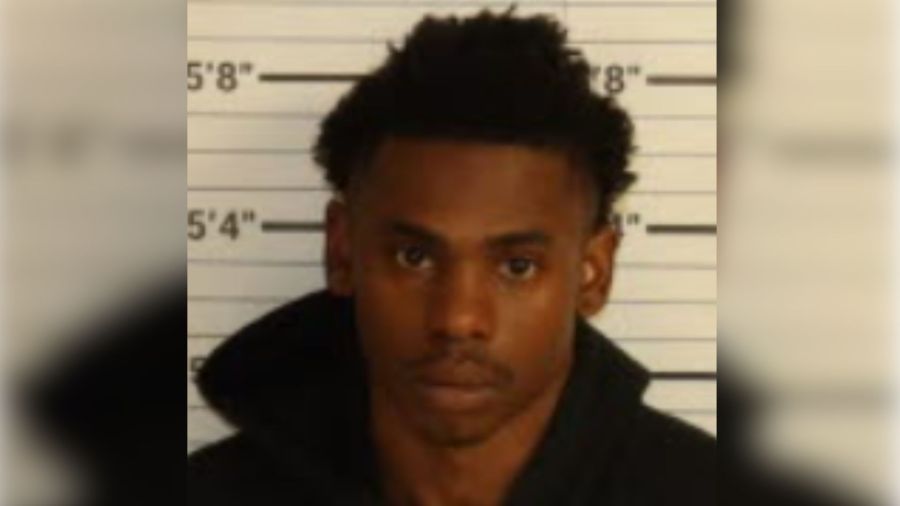 Suspect accused of strangling, robbing man at gunpoint