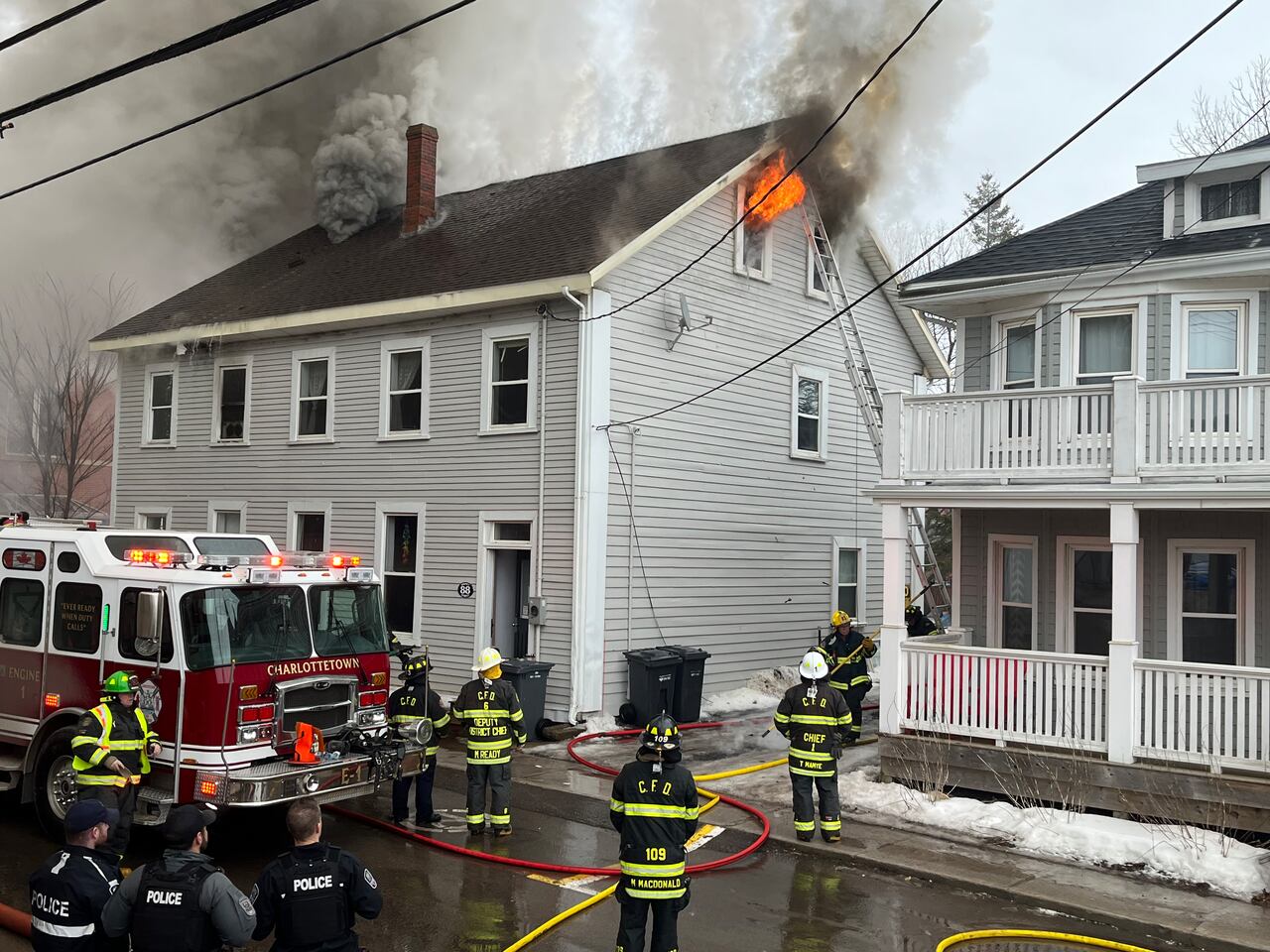 Flames shoot out of windows as apartment building burns in downtown ...