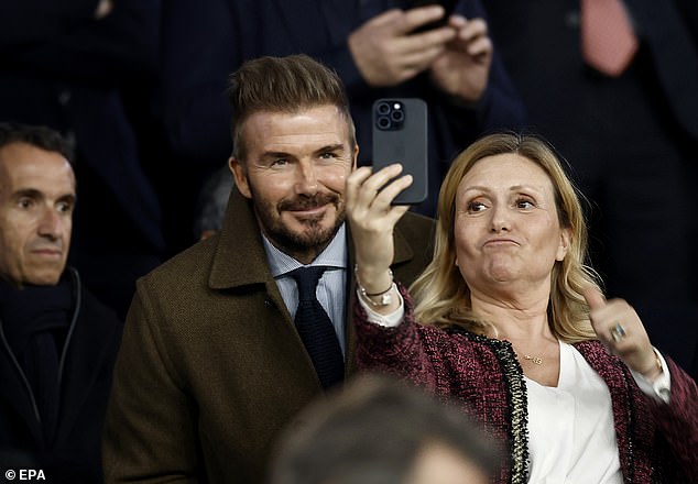 David Beckham poses for photos with fans as he watches former side PSG ...
