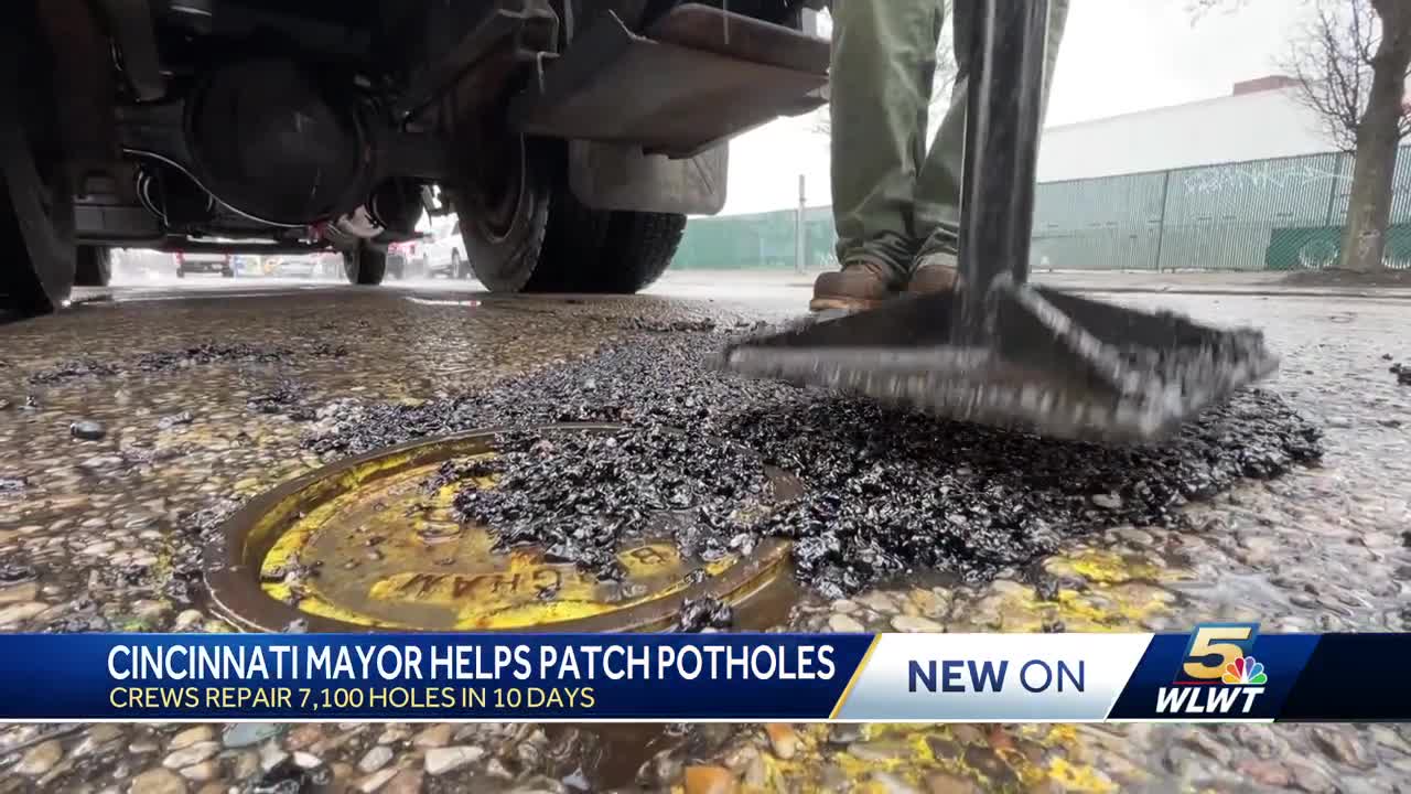 Cincinnati mayor Pureval helps patch potholes as crews continue repairs
