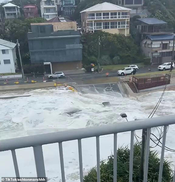 Aussies stranded as road becomes covered by cyclone's storm surge