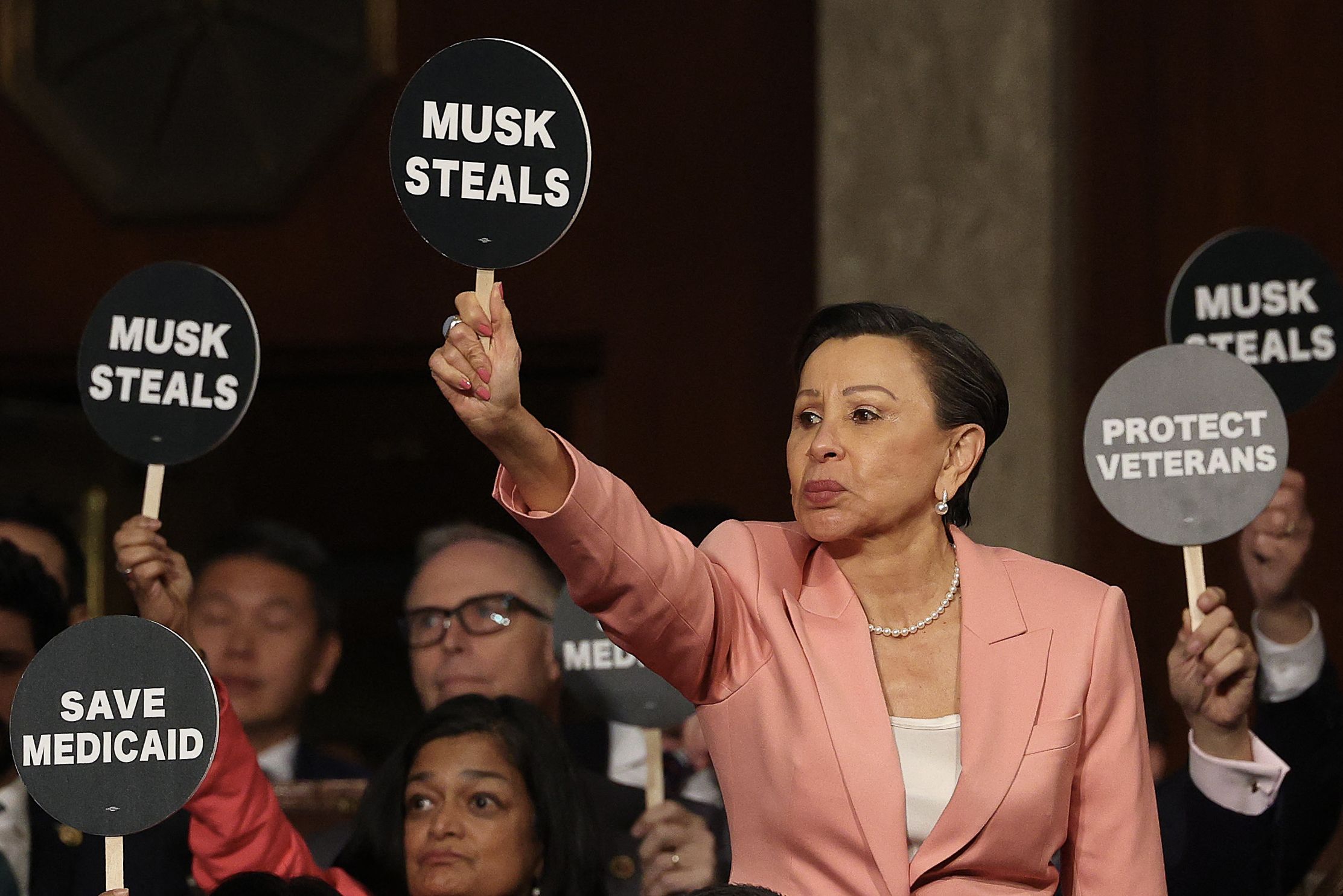 In photos: Democrats protest Trump's speech