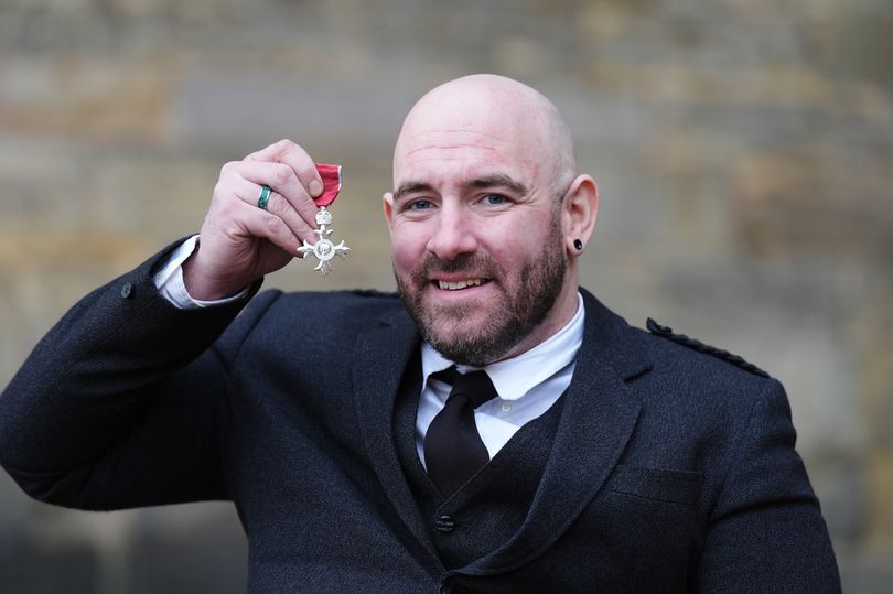 Addiewell archer receives his MBE as proud gran, wife and dad look on