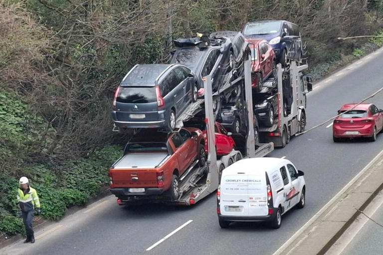 Car roof 'ripped off' after car transporter hits bridge on busy Cork road