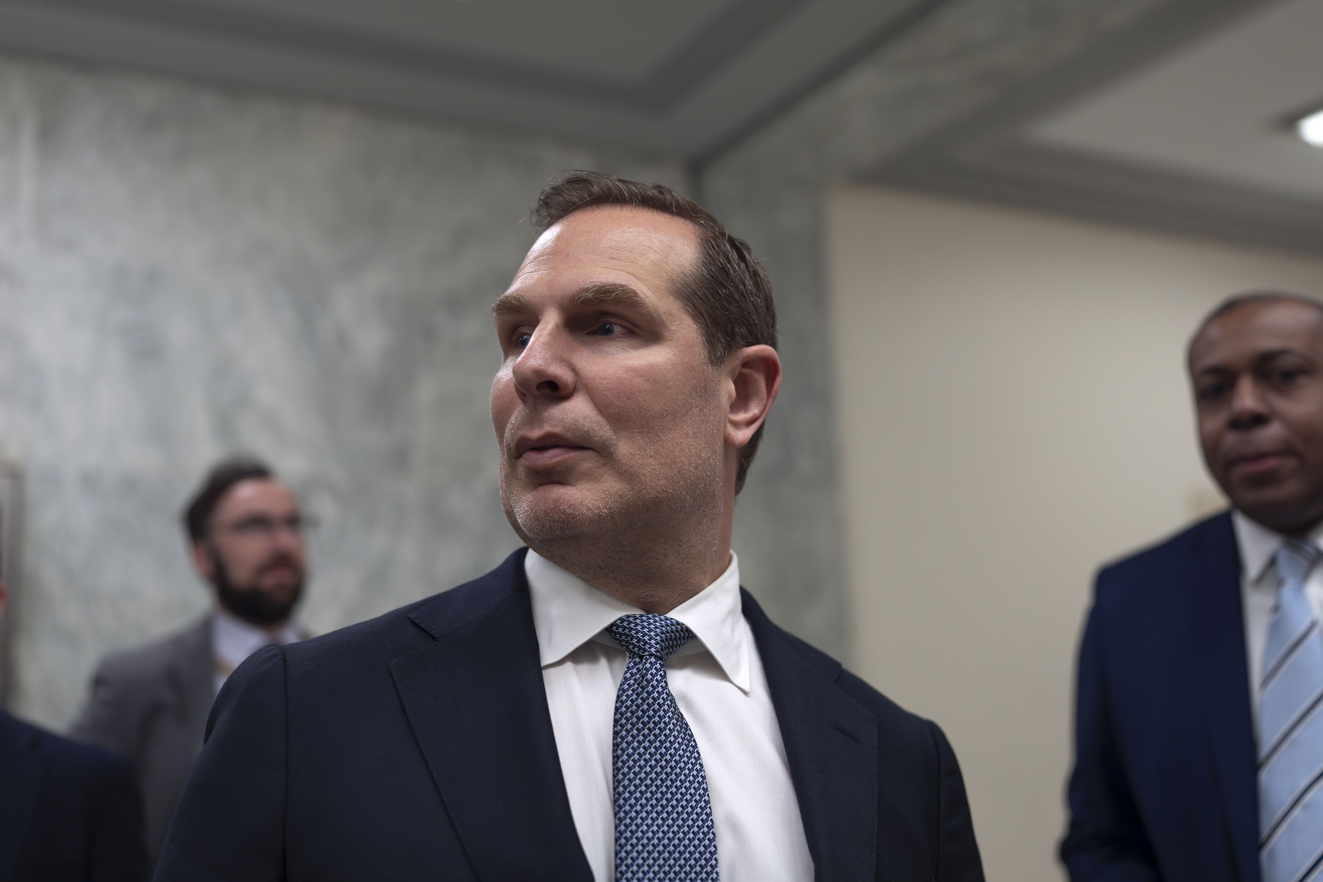 Judge temporarily halts Trump administration from ousting head of ...