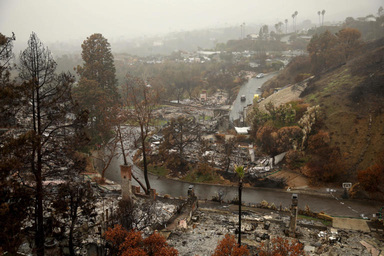 Evacuation warnings issued in LA wildfire burn areas ahead of storm
