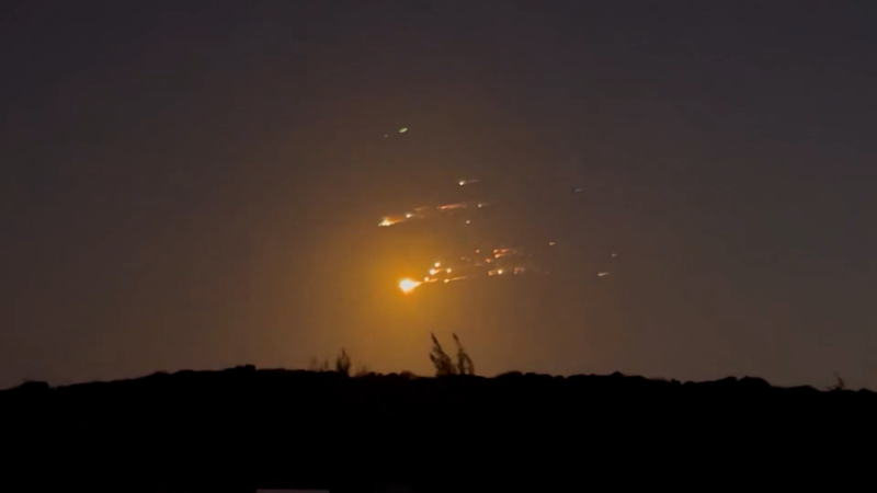 Debris rains through the sky after SpaceX test flight explosion
