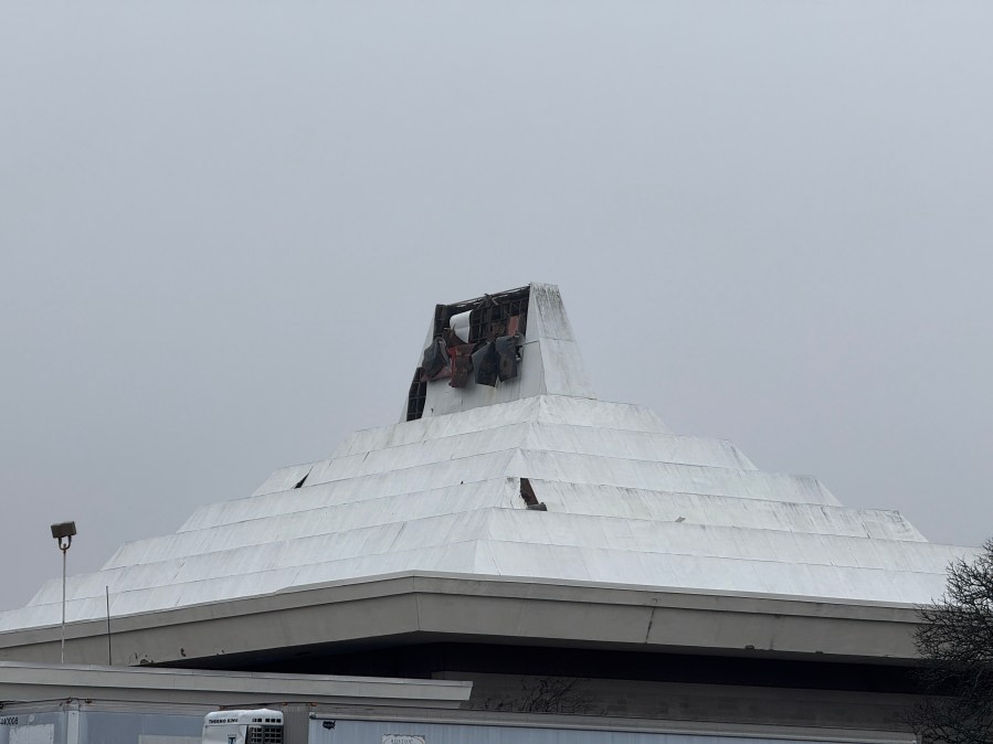 Wind blows sign off of Pawtucket’s Apex building