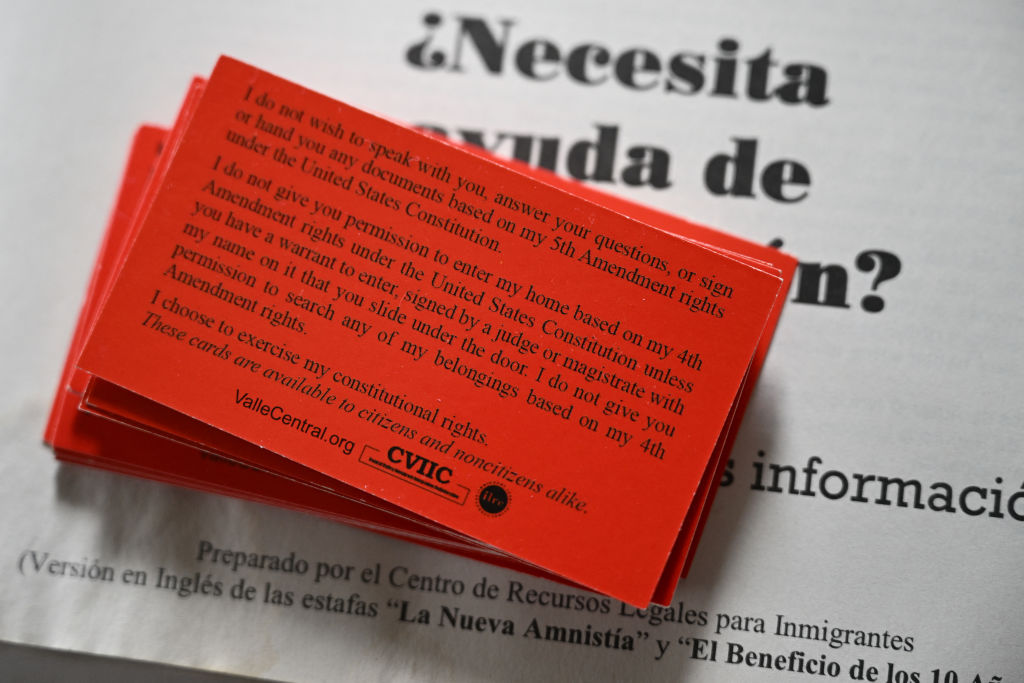 Red cards handed out to immigrants who fear deportation under Trump