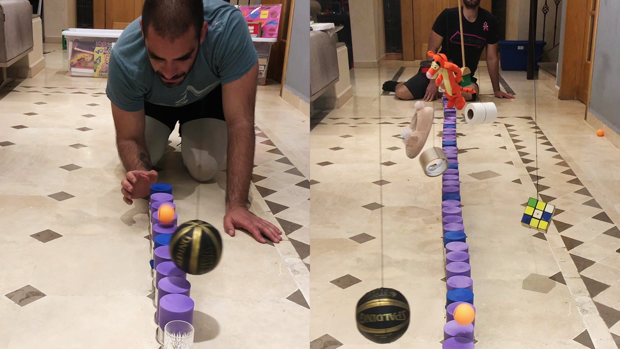 'Ping Pong Ball Bounces Off 50 Cups While Avoiding Obstacles'