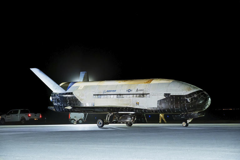 US military's mini space shuttle returns to Earth after orbiting for ...