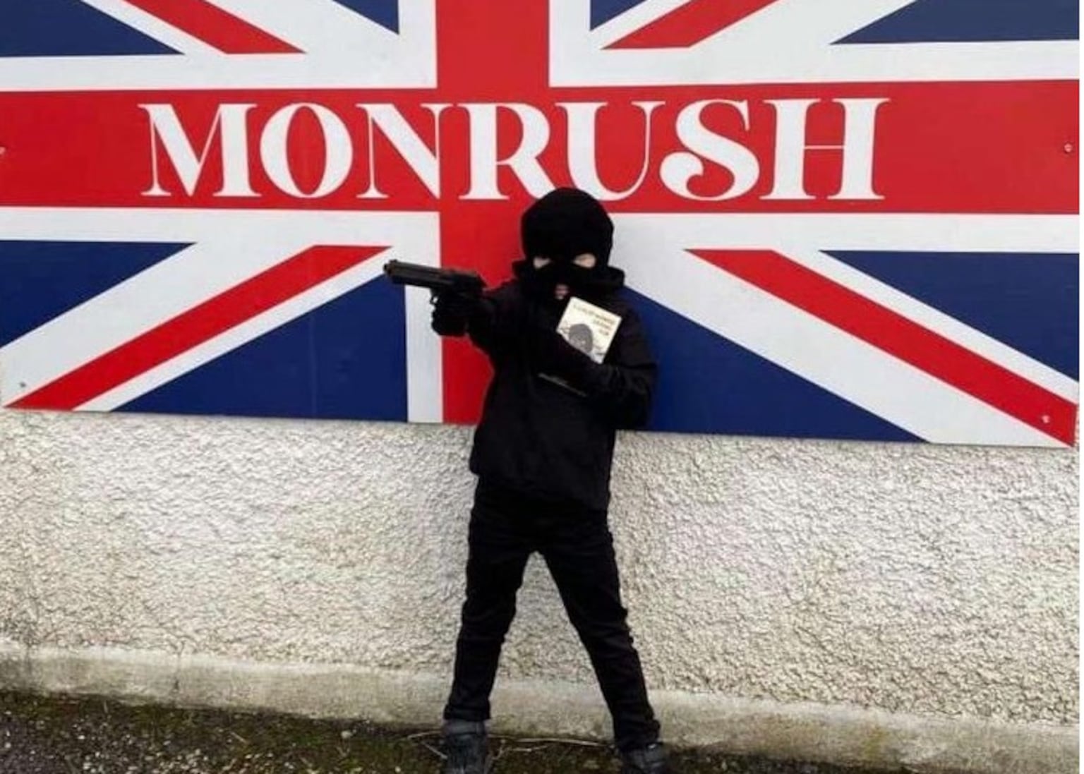 Child dressed as balaclava wearing loyalist gunman for World Book Day