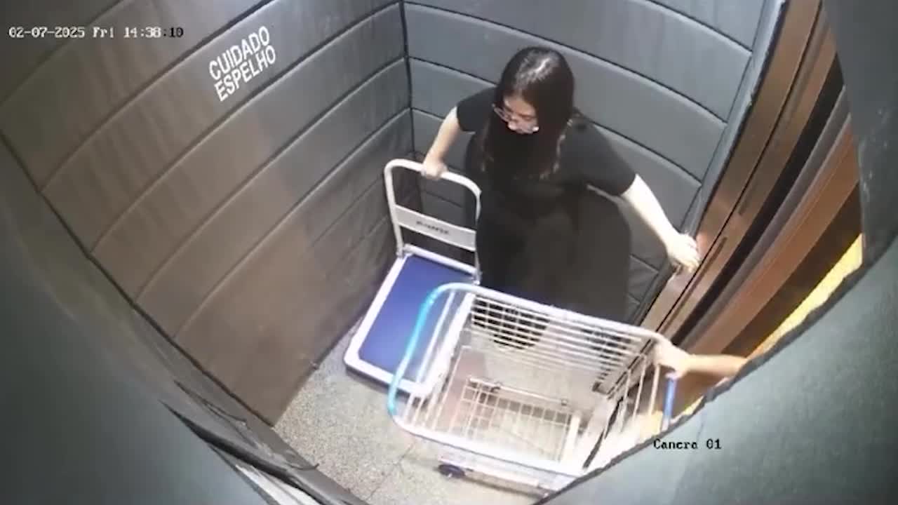 Woman hoisted in the air when lift door traps trolley cable