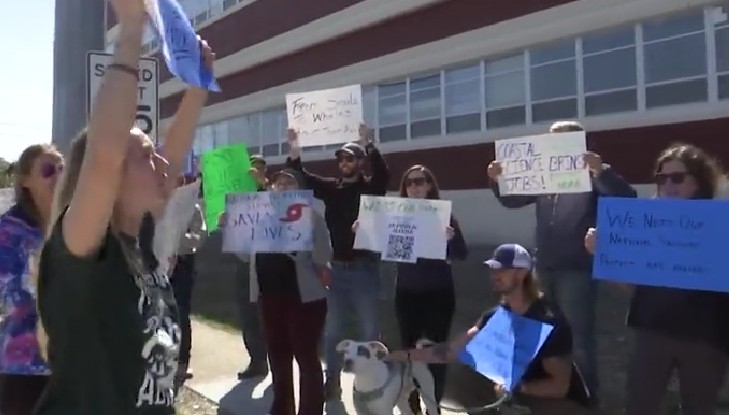 People protest against layoffs to NOAA and National Park Workers