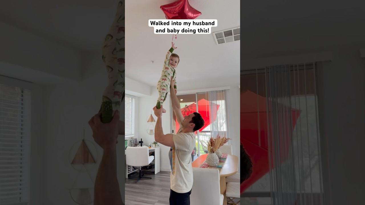 Mom walks in on dad and baby playing with balloons