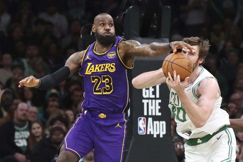 LeBron James injured in crunch time as Celtics end Lakers' 8-game ...