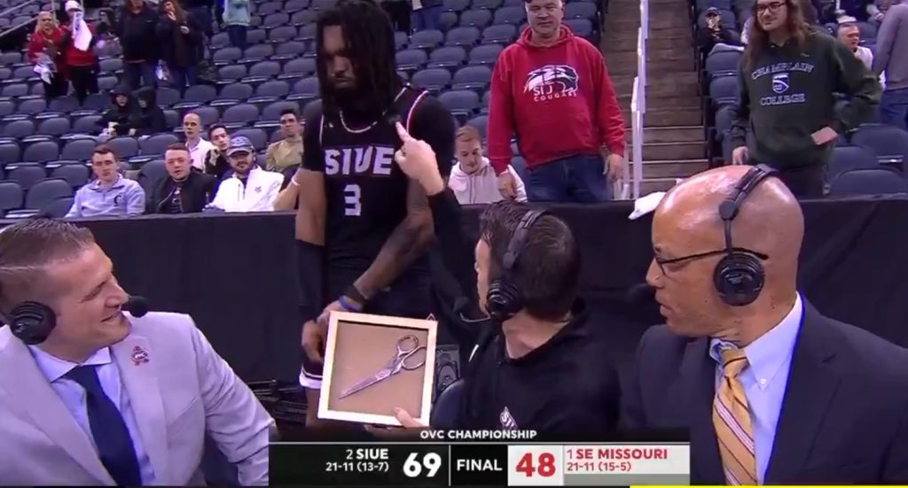 Coach celebrated NCAA Tournament berth with framed scissors