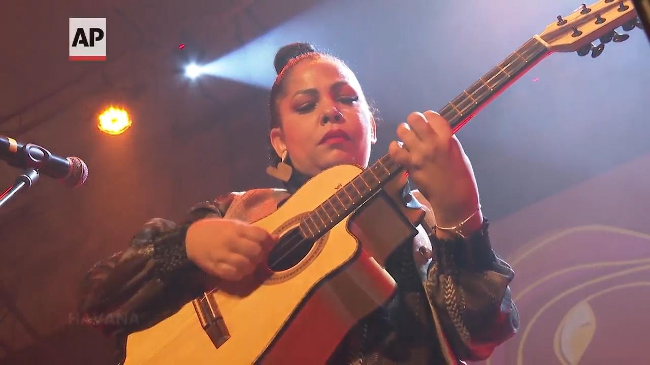 Female Cuban musicians demonstrate mastery of the tres on International ...