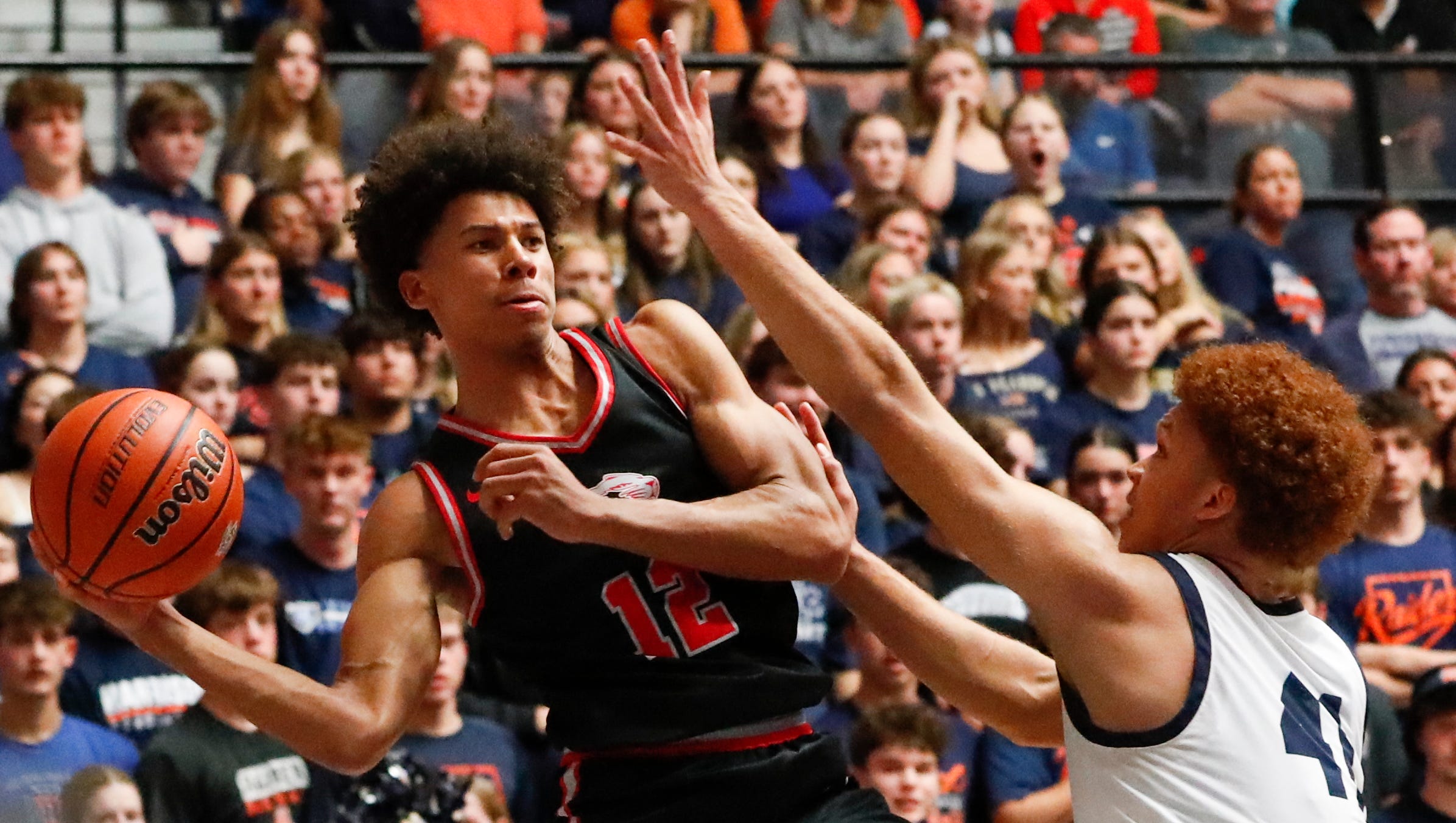 Harrison forward Malachi King and Justin Kirby of Fishers share bond at IHSAA regionals