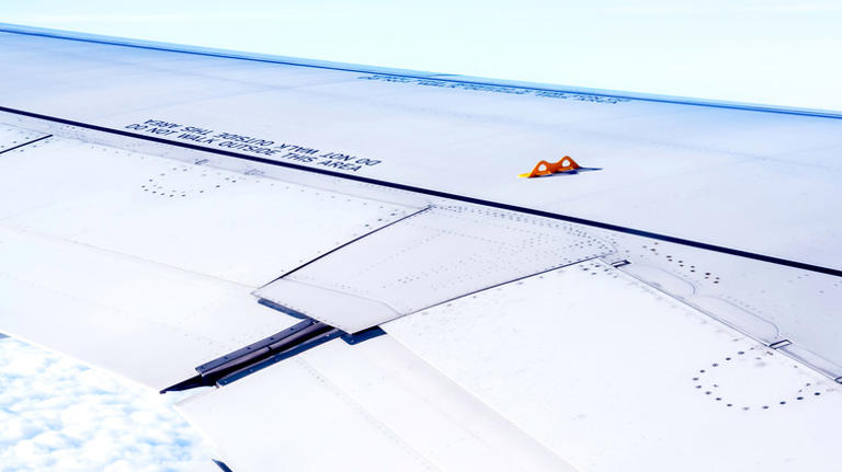 What Are The Yellow Hooks On Airplane Wings For?