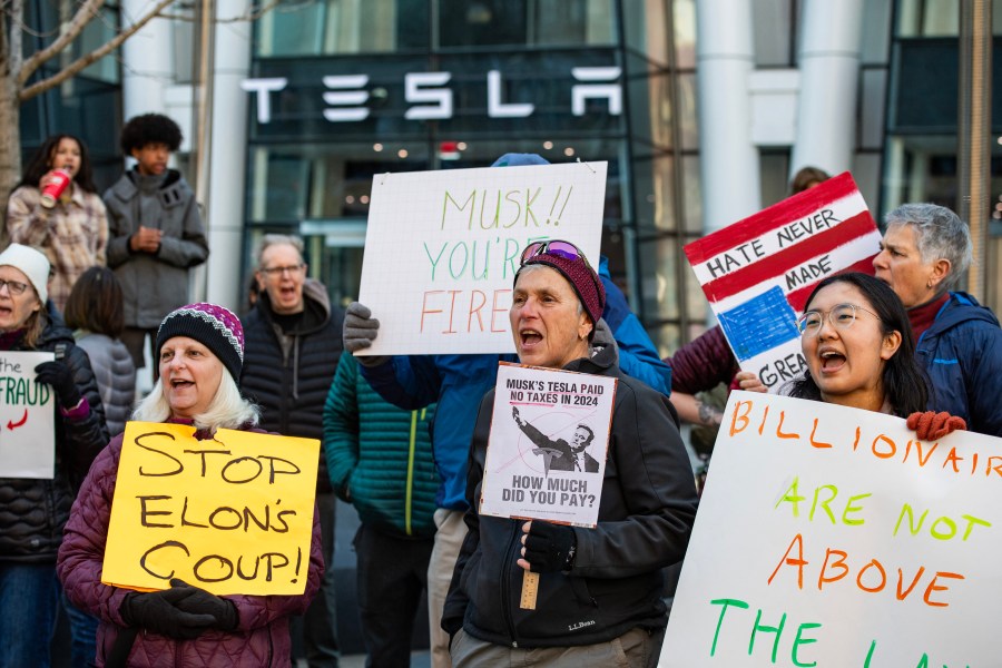 Hundreds protest Tesla showrooms over Musk’s DOGE work
