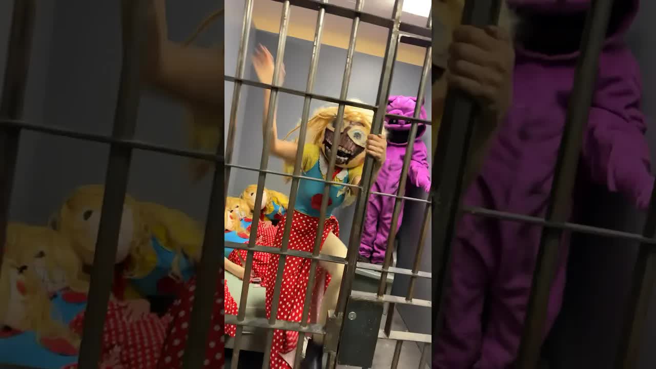 Creepy Doll in Jail Cell with Purple Monster